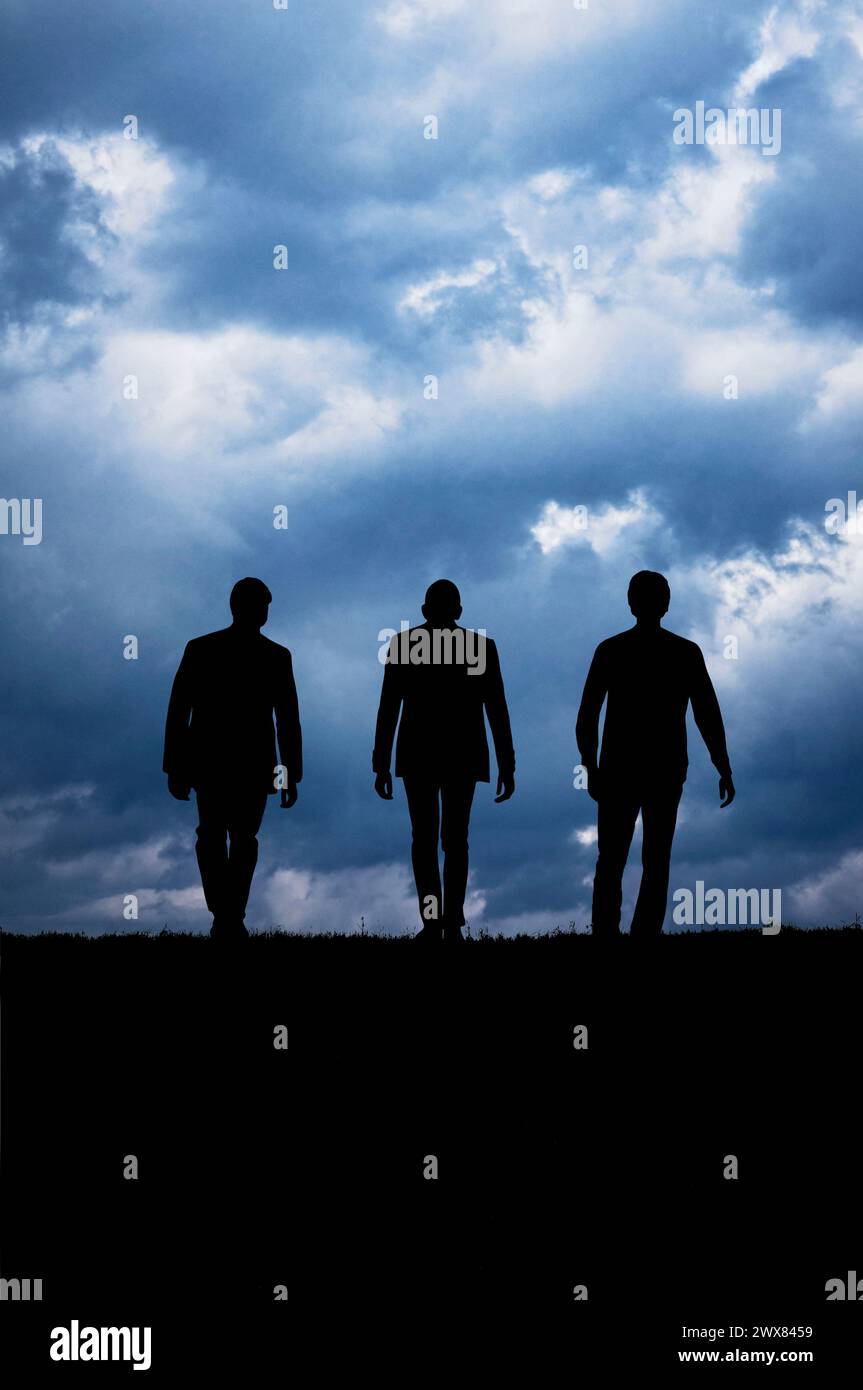 Three men walk hi-res stock photography and images - Alamy