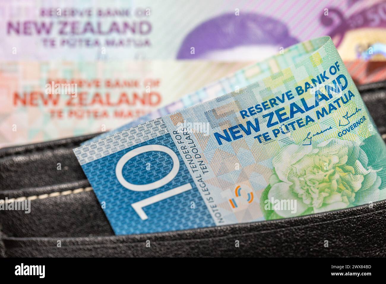 New Zealand money, 10 dollar banknote sticking out of the wallet Stock ...