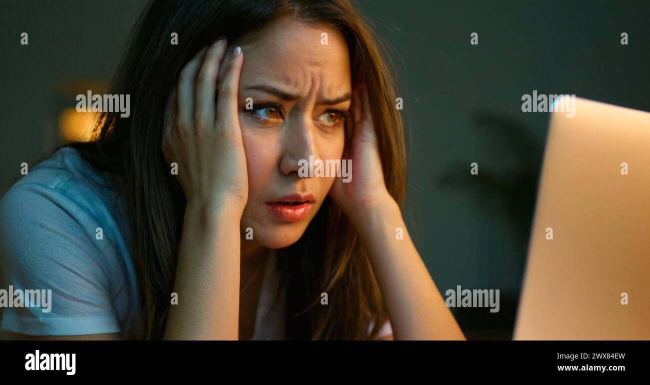 A young woman sees a mistake in her computer Stock Photo - Alamy