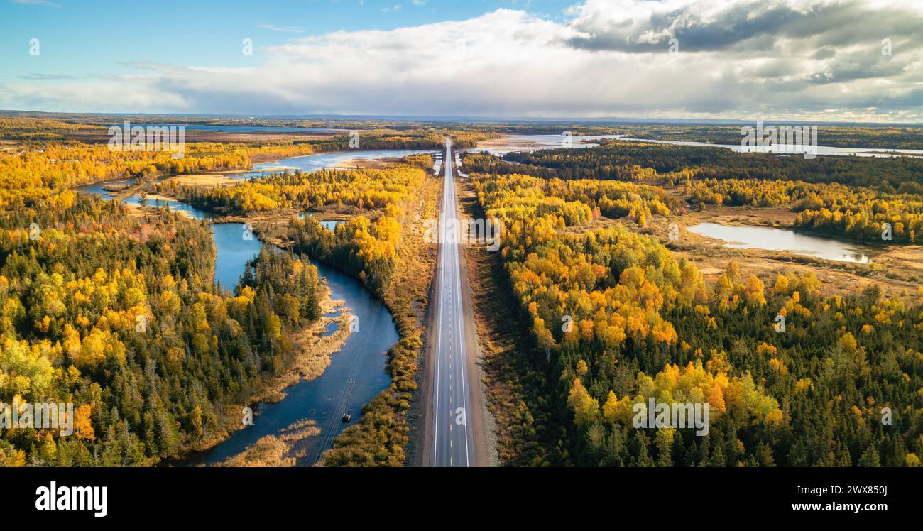 Highway Road by vibrant fall season color trees. Sunny Sky Aerial View ...