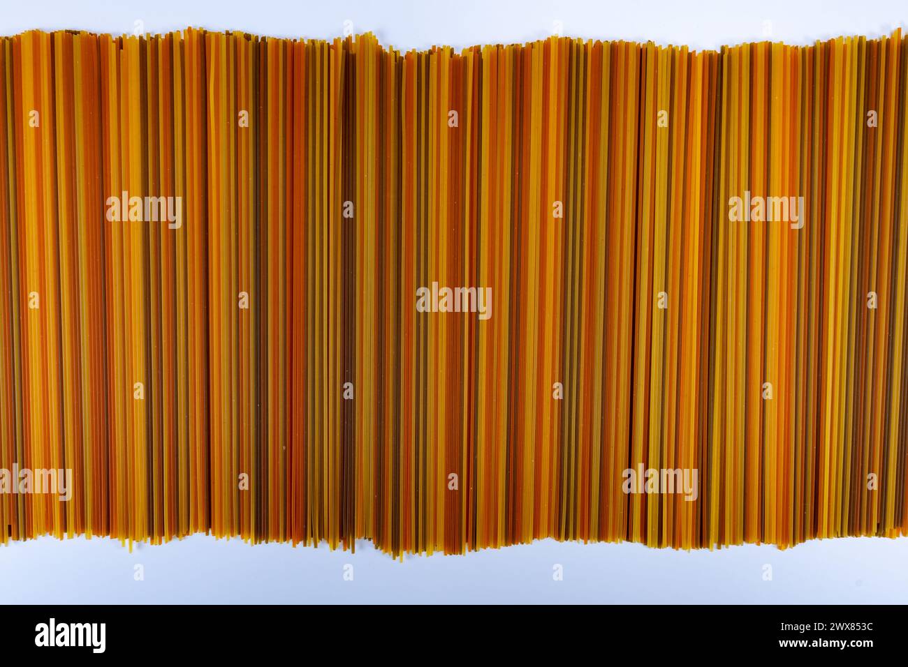 Food background, colorul dried pasta spaghetti, paralleled lines ...