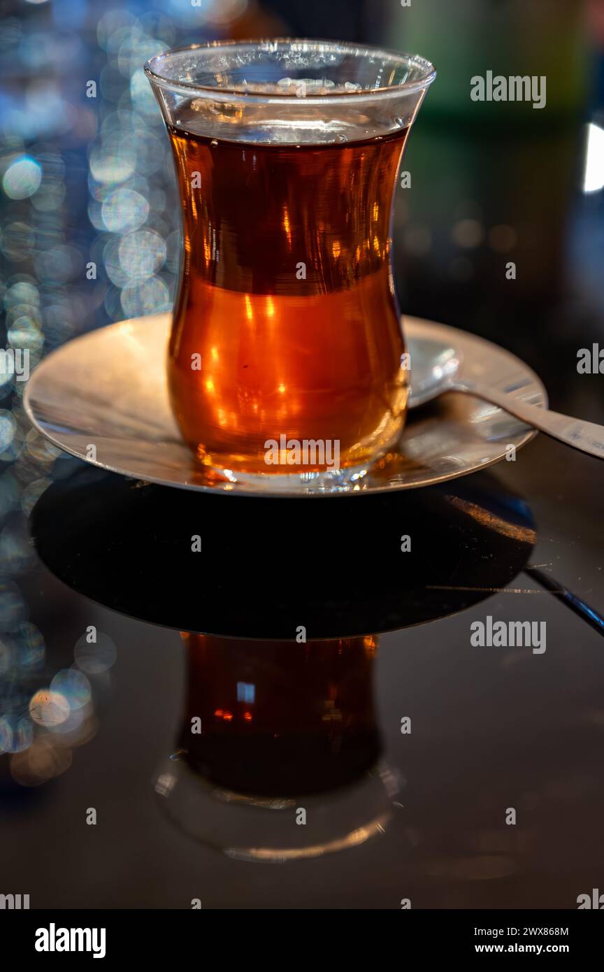 Turkish sweet tea served in traditional glass in restaurant in Istanbul ...