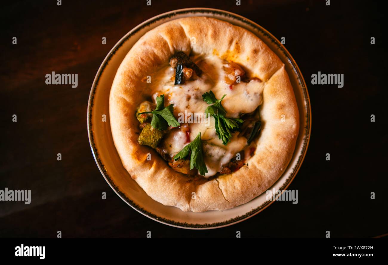 A savory dish of veal and roast vegetables in tomato sauce, presented ...