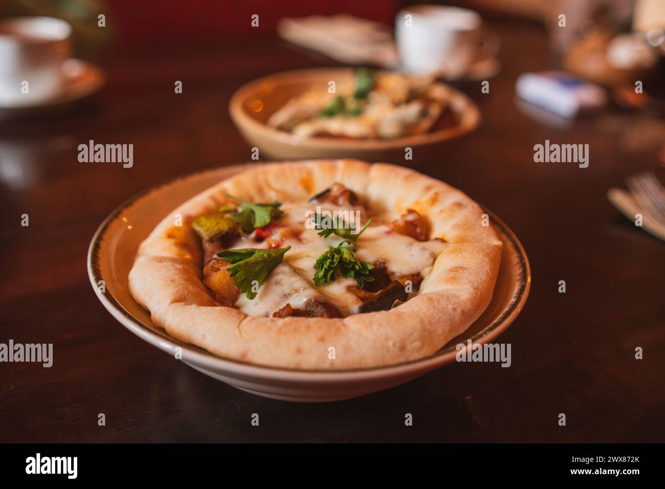 A savory dish of veal and roast vegetables in tomato sauce, presented ...