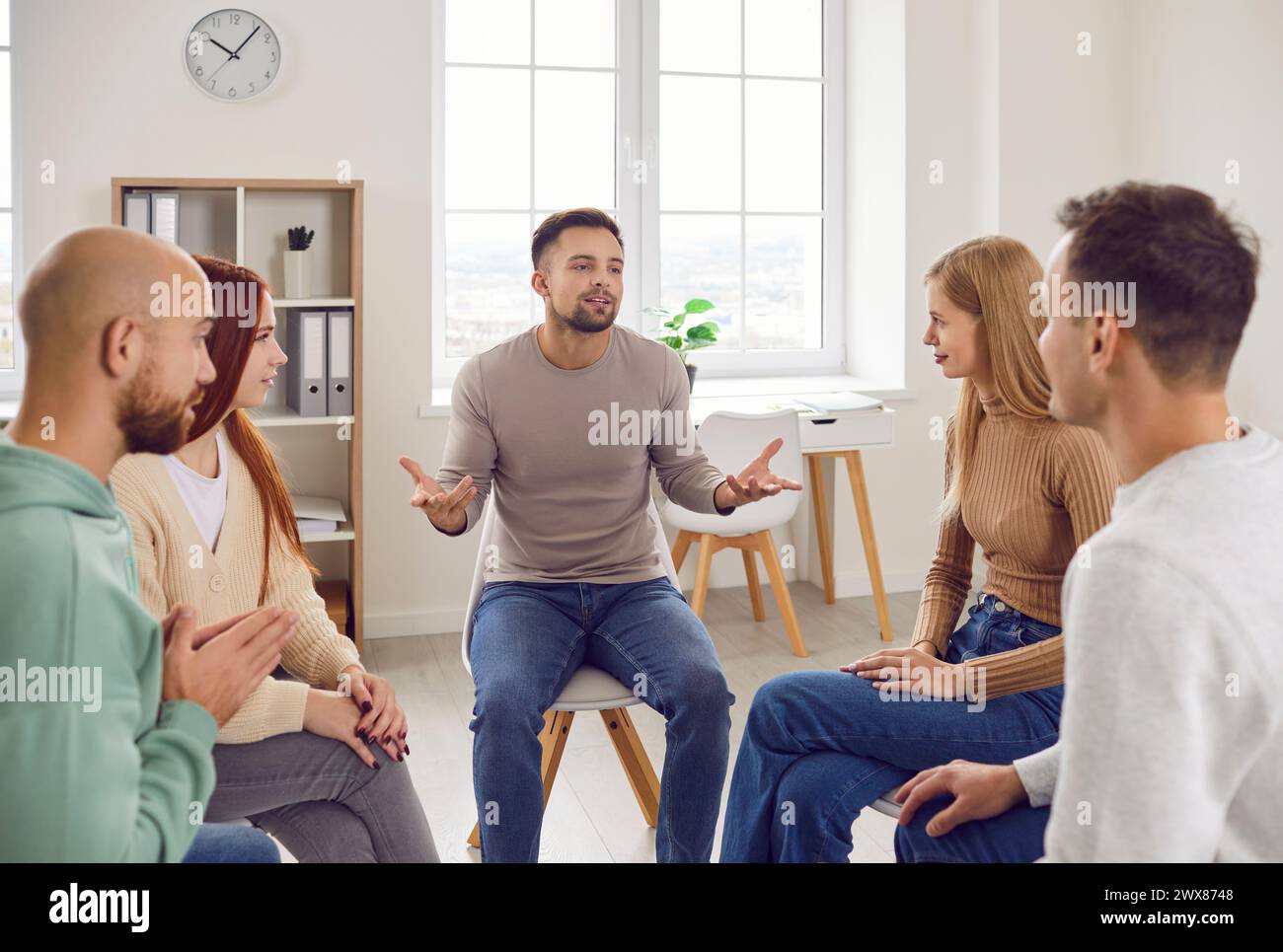 Young adults group therapy counseling hi-res stock photography and ...