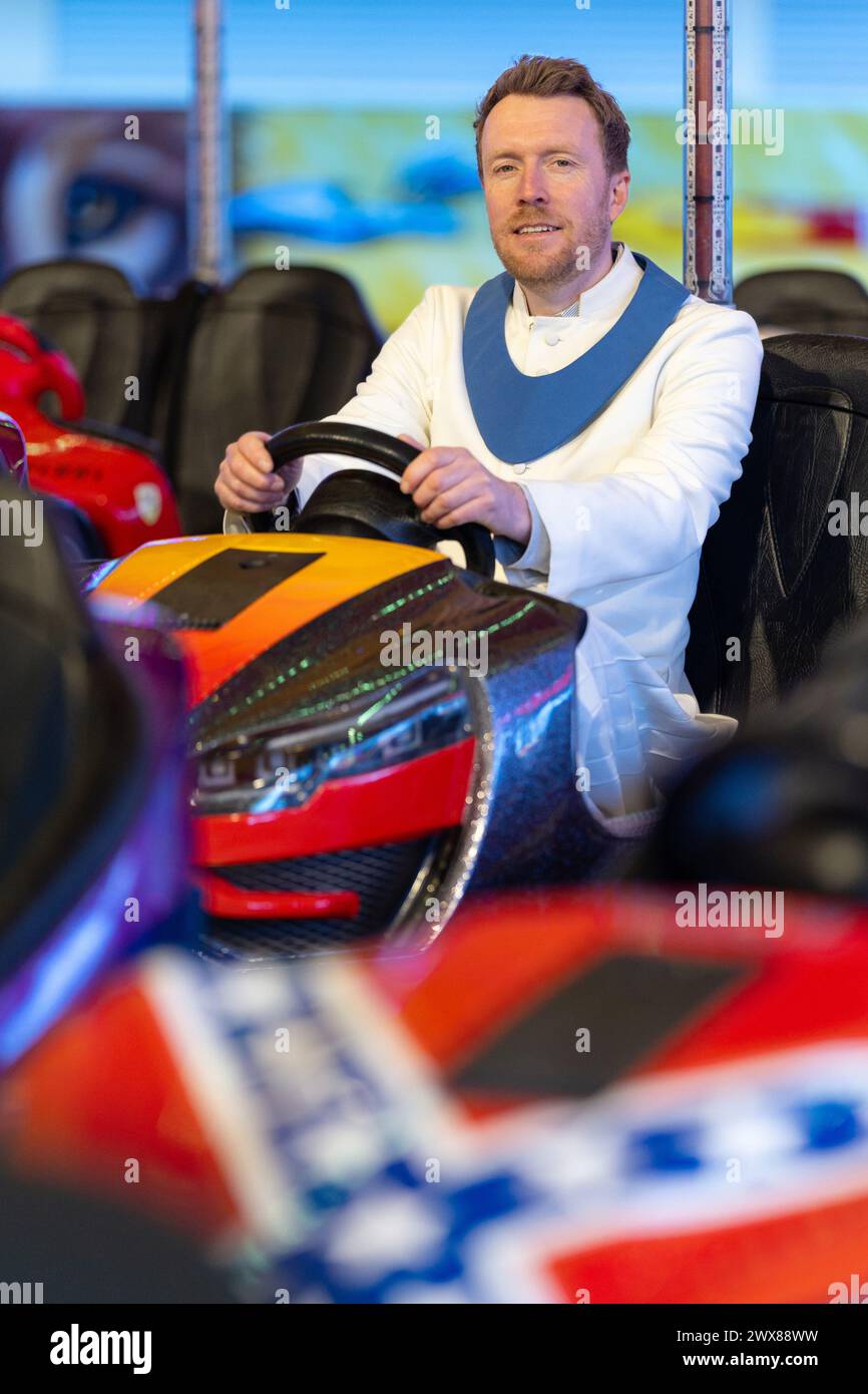 Erfurt, Germany. 28th Mar, 2024. Fairground pastor Klaus Zebe sits in a ...