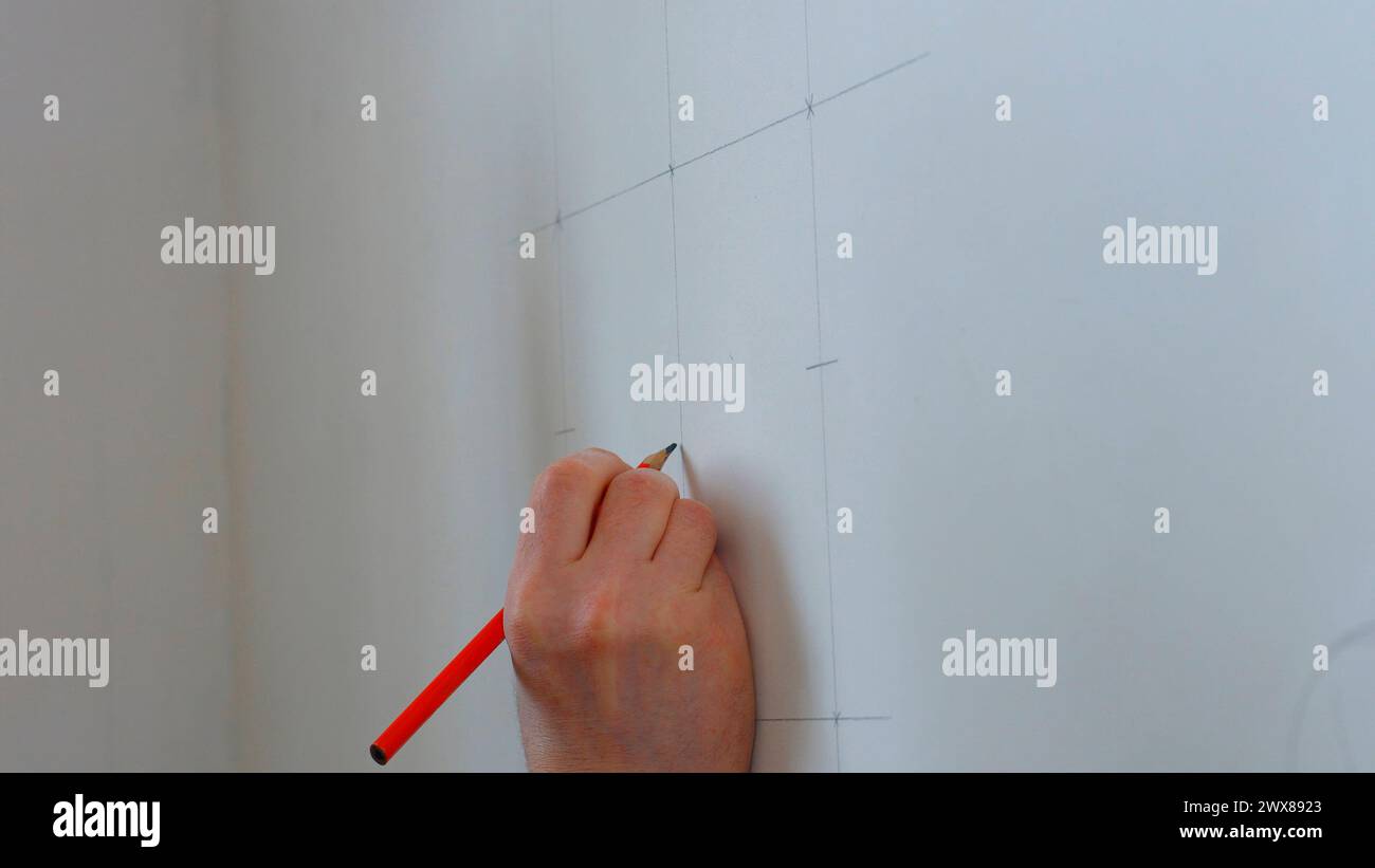 Builder draws marking on the wall. Worker making measurements Stock ...