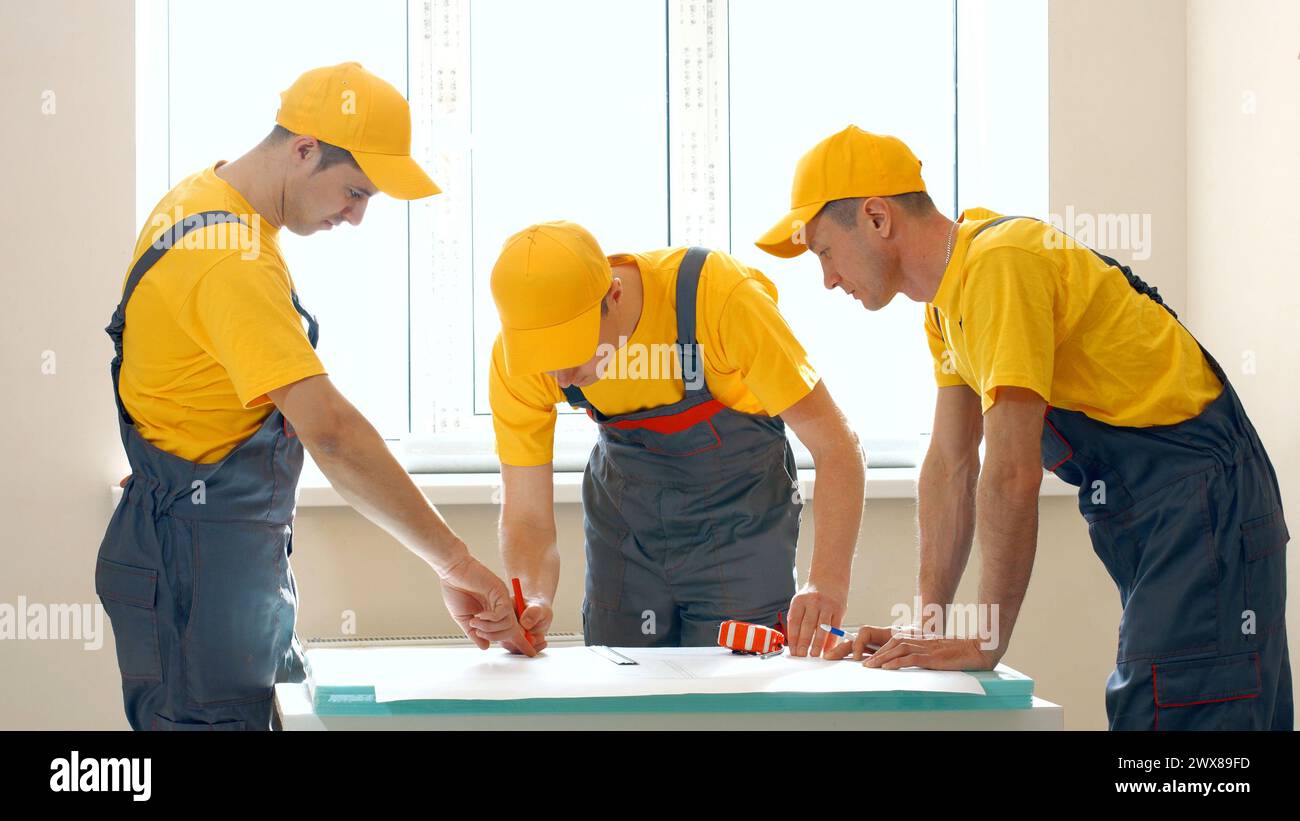 Large construction company discusses the project. Engineers look ...