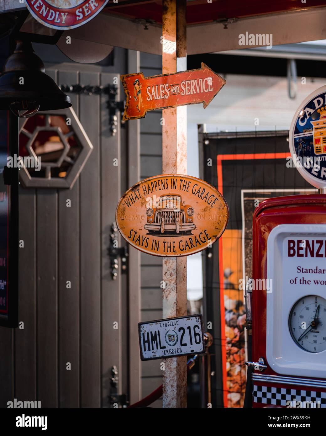 The Assorted gas pump signs and other decorations Stock Photo - Alamy