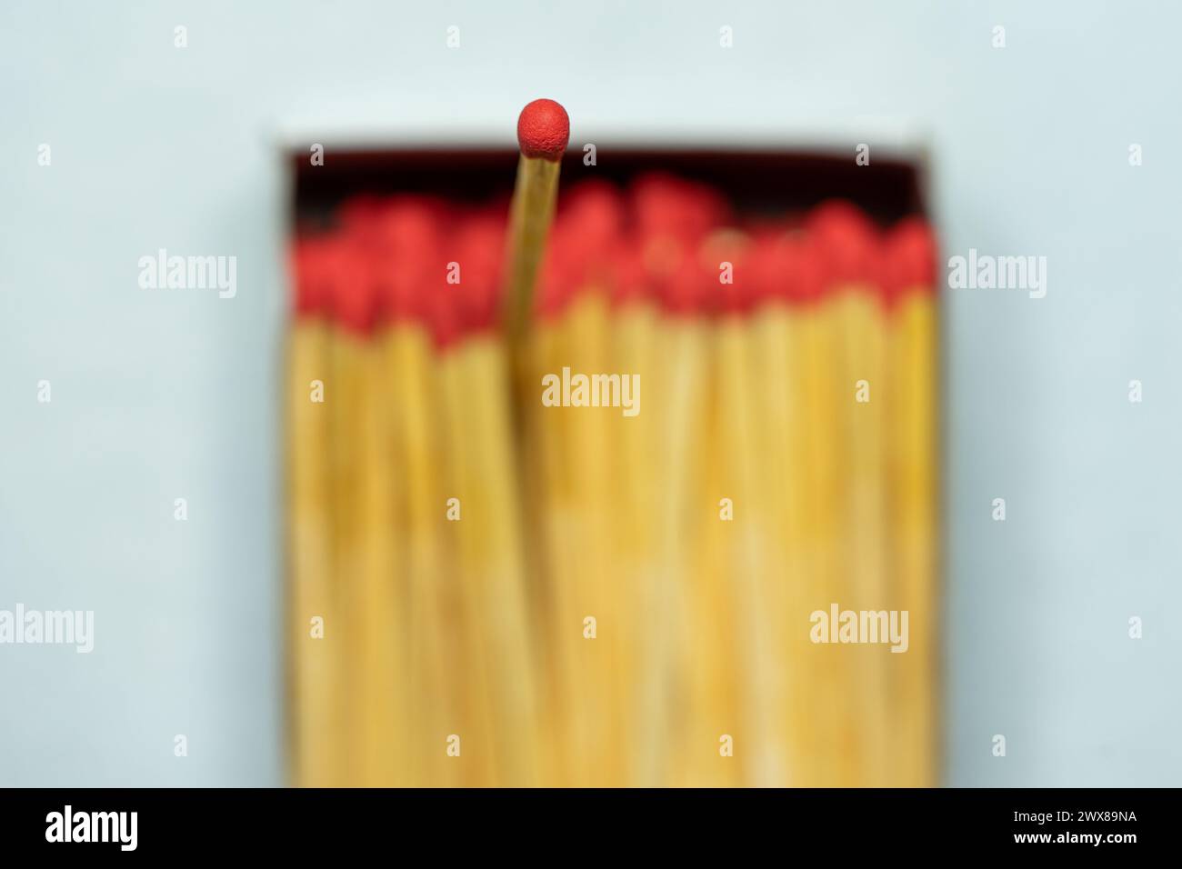 Set of several defocused red-headed matchsticks with one red-headed ...