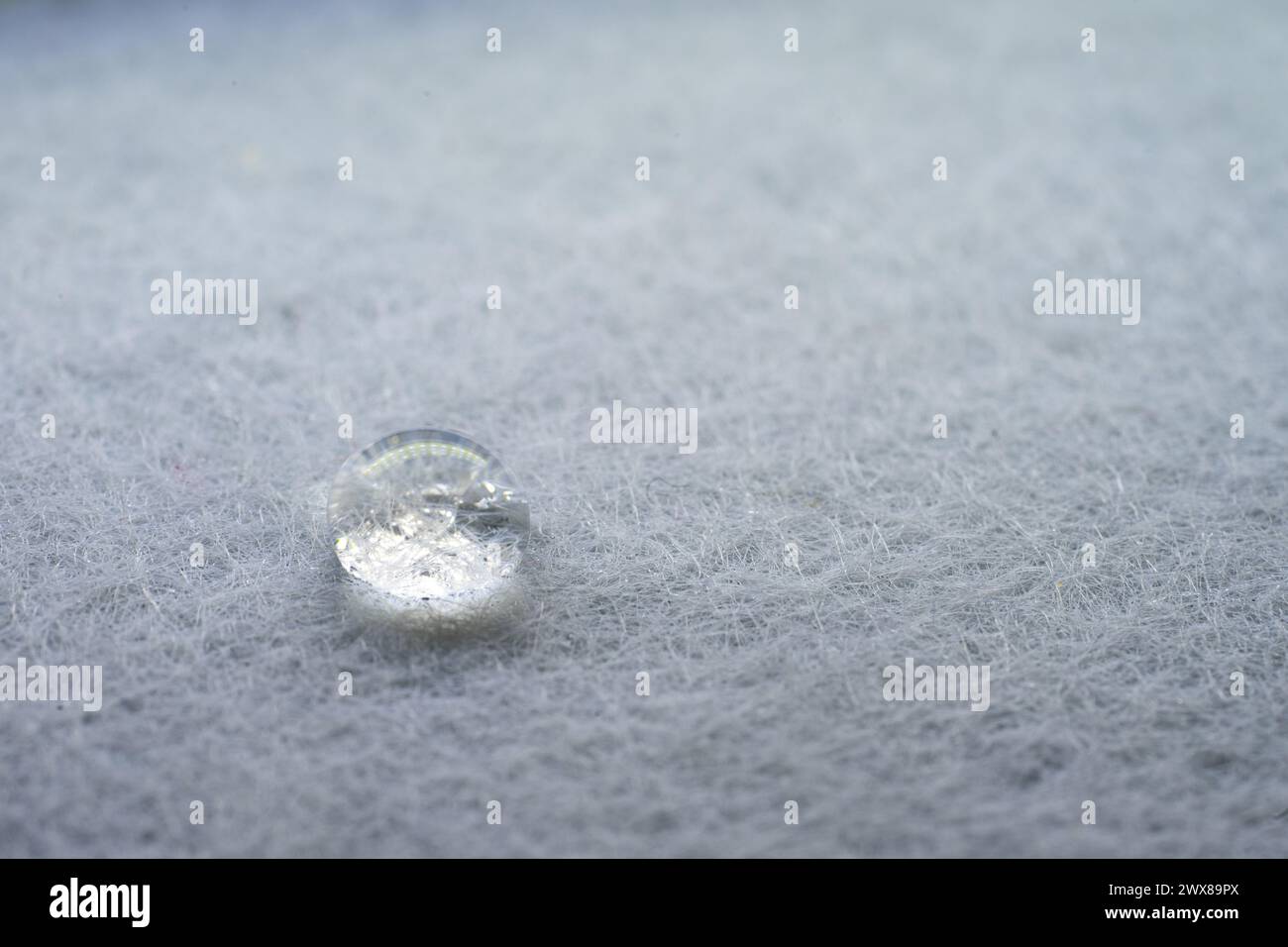 Water drop on top of white fabric sheet Stock Photo - Alamy