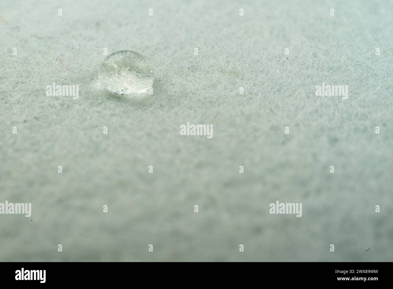 Water drop on top of white fabric sheet Stock Photo - Alamy
