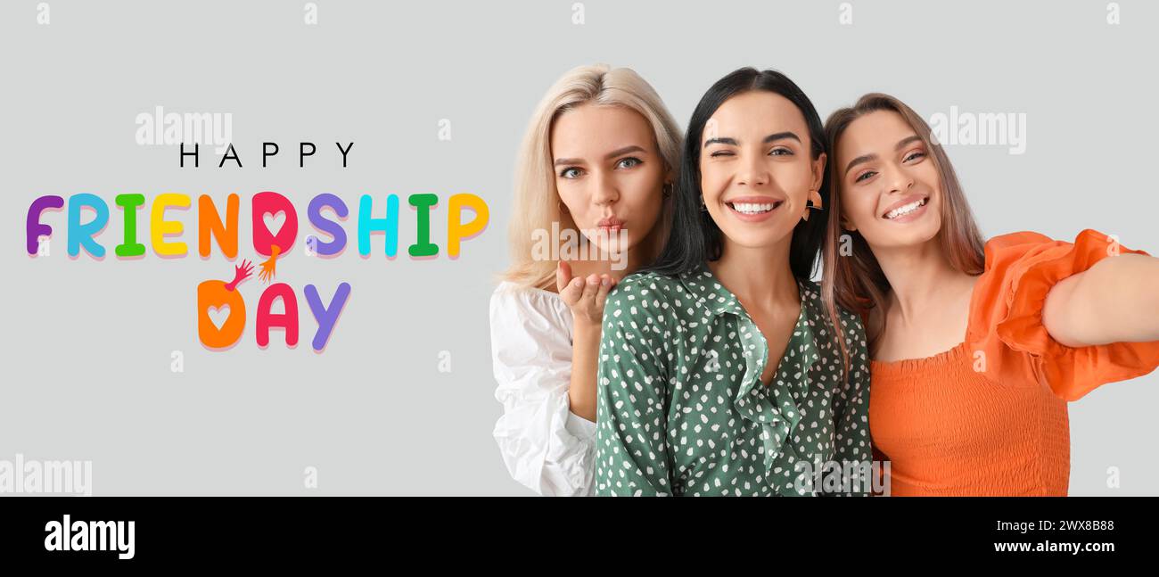 Beautiful young women taking selfie on grey background. Banner for ...