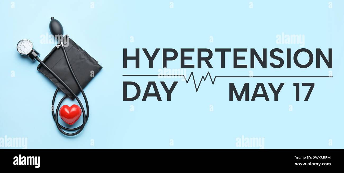 Sphygmomanometer and red heart on light blue background. Banner for ...