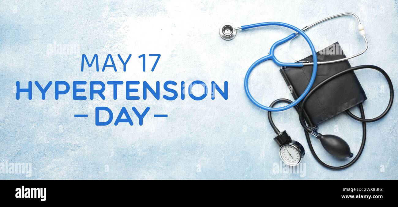 Sphygmomanometer and stethoscope on light blue background. Banner for ...