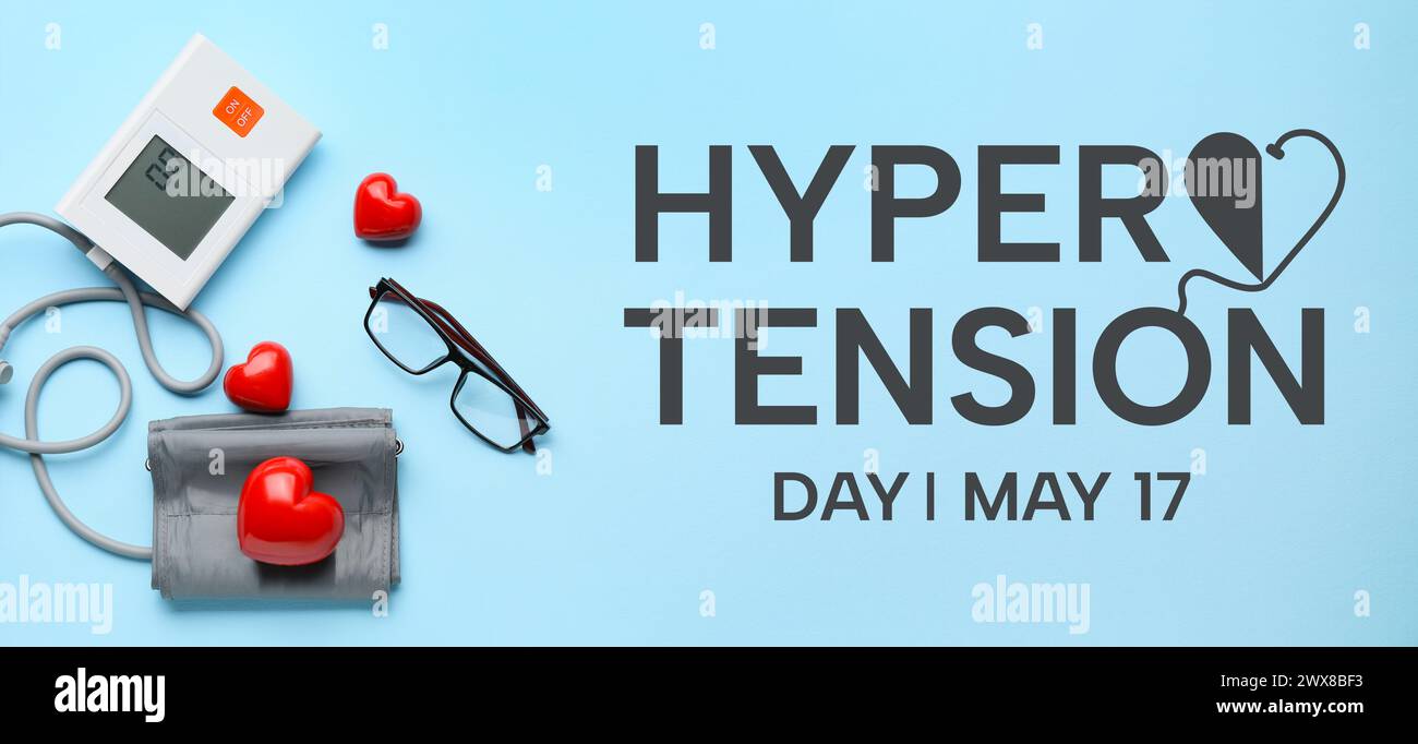 Sphygmomanometer and red hearts on light blue background. Banner for ...