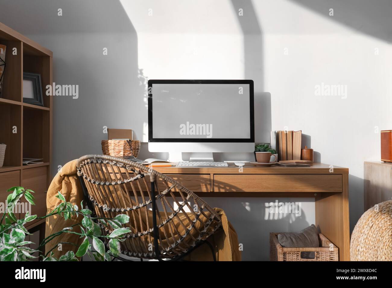 Modern workplace with computer, books and chair in light office Stock ...