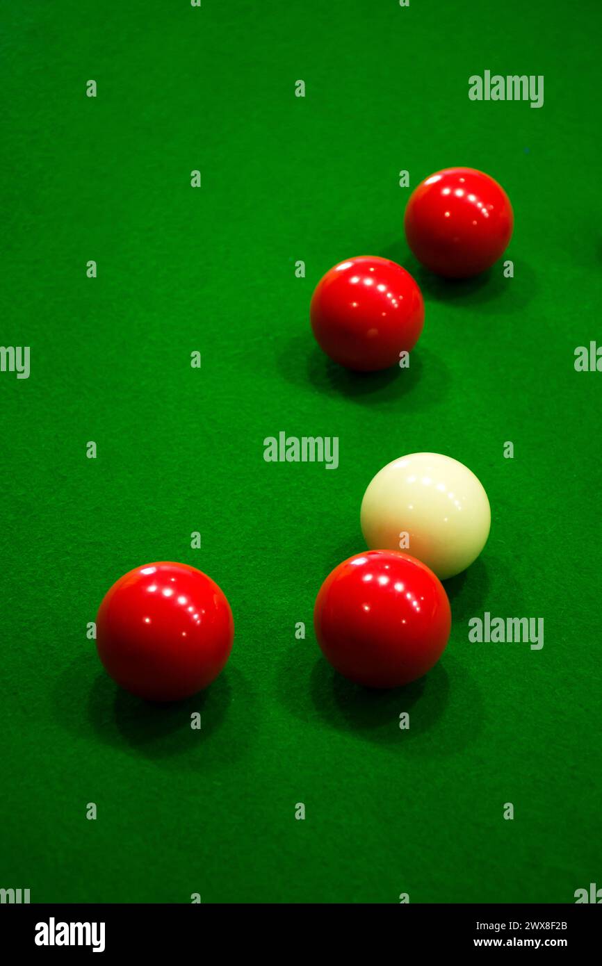Red and white balls on a table in the foreground Stock Photo - Alamy