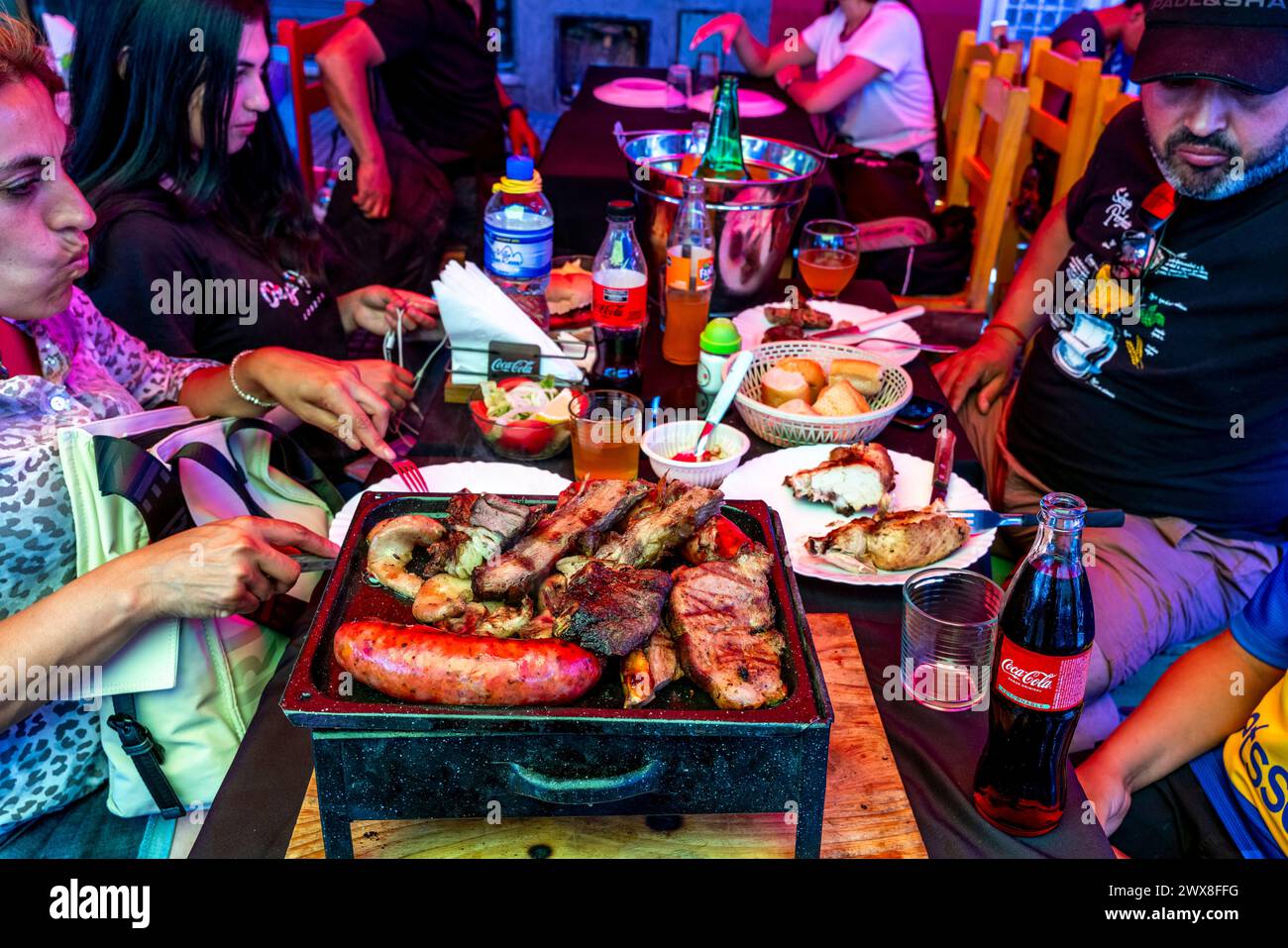 People Eating A Traditional Asado/Barbecue Meal A Restaurant In The La ...