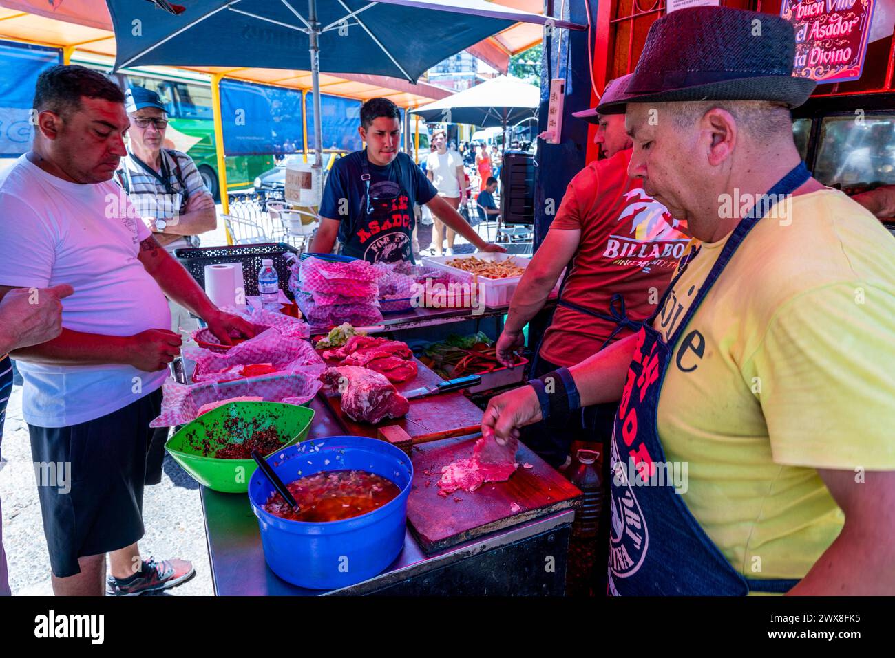 Men Preparing and Cooking Meat In The Street In The La Boca District of ...