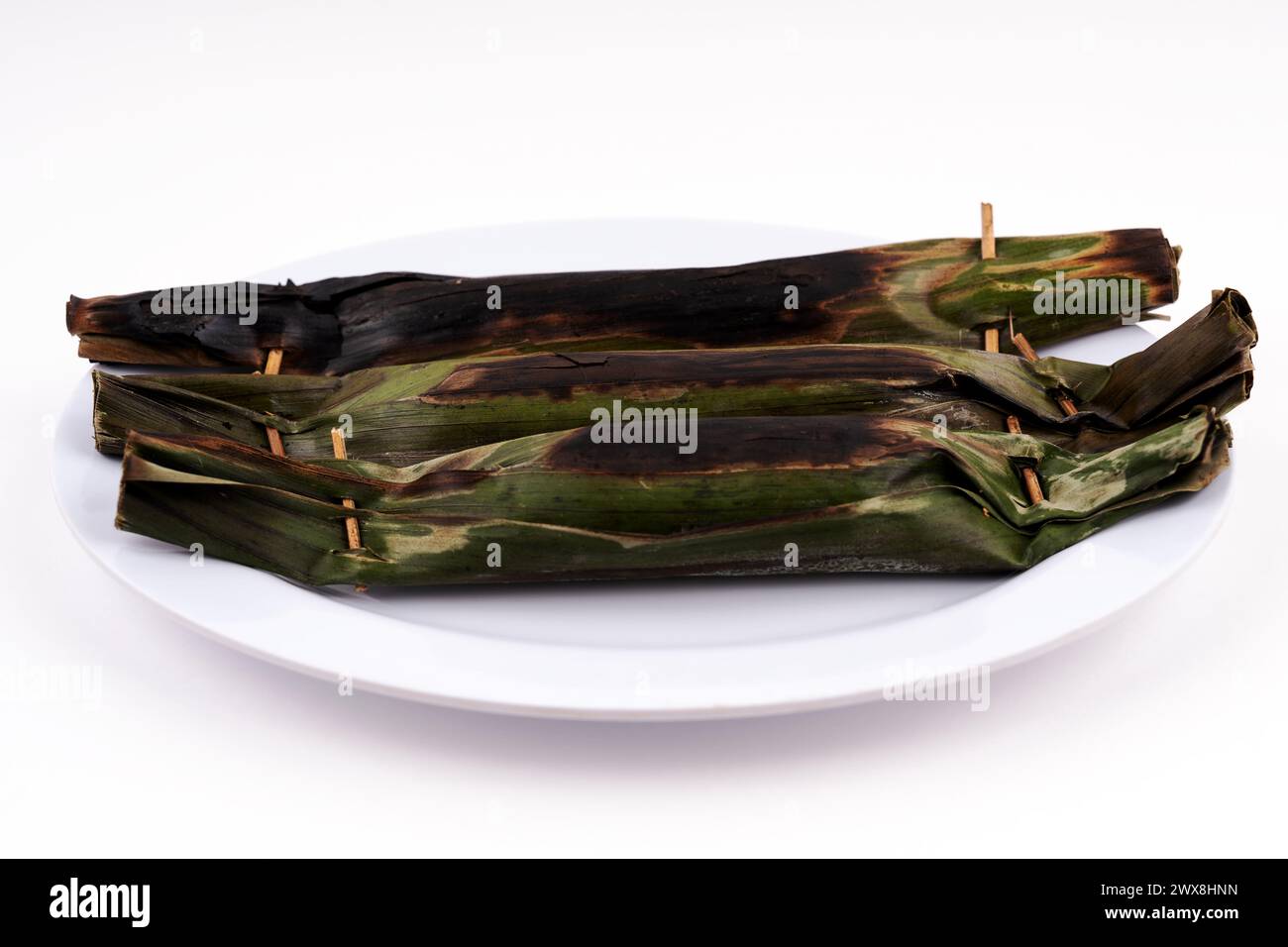 Pulut Panggang or grilled glutinous rice on white background Stock ...