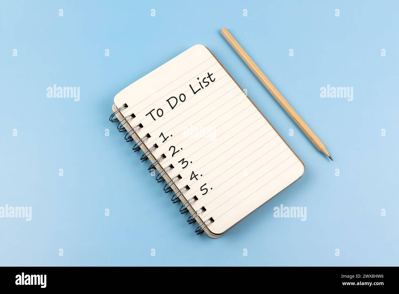 To do list text on notepad on blue background Stock Photo - Alamy