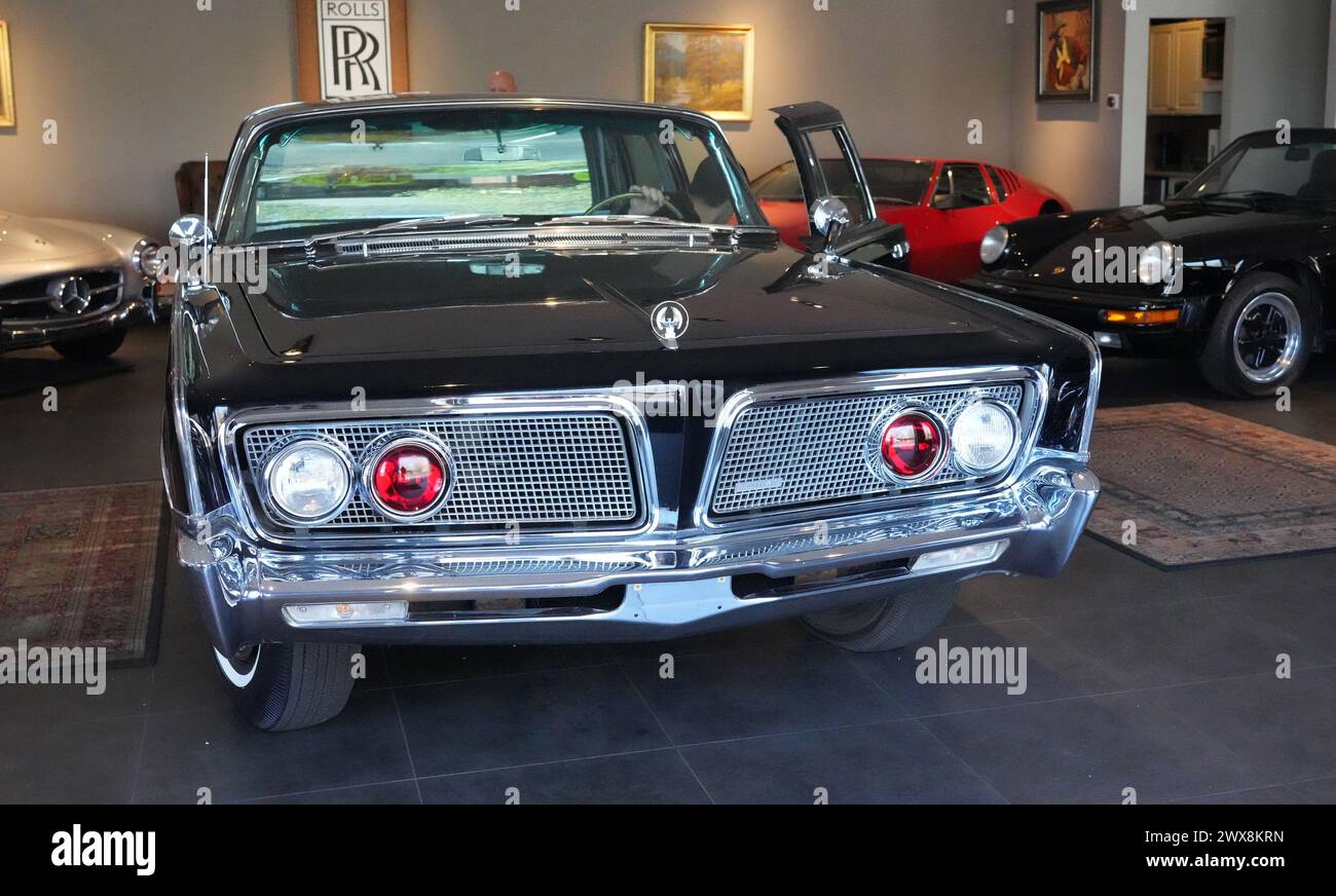 Salesman Tyler Leighty backs the 1964 Imperial Crown Presidential Limo ...