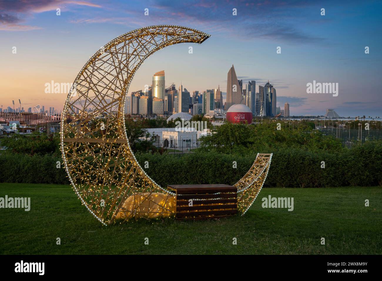 A crescent moon-shaped decorations with lights during Ramadan at Doha ...