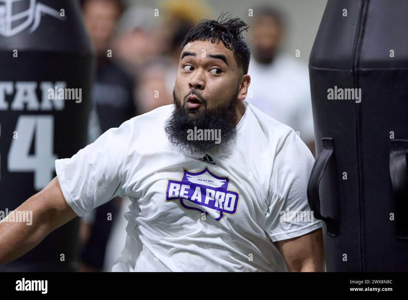 Washington defensive lineman Tuli Letuligasenoa runs through drills ...