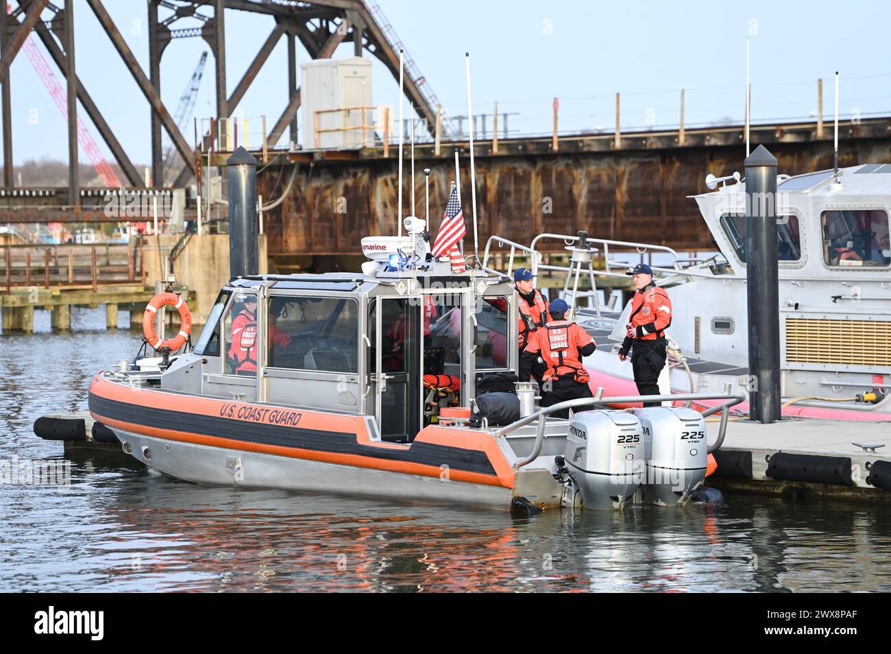 Baltimore, Maryland, USA. 26th Mar, 2024. U.S. Coast Guard Station Curtis Bay response crews get ...