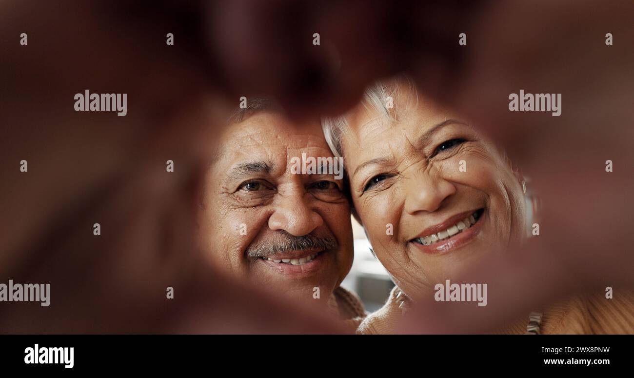 Happy, selfie and senior couple in a living room with heart, hands or ...