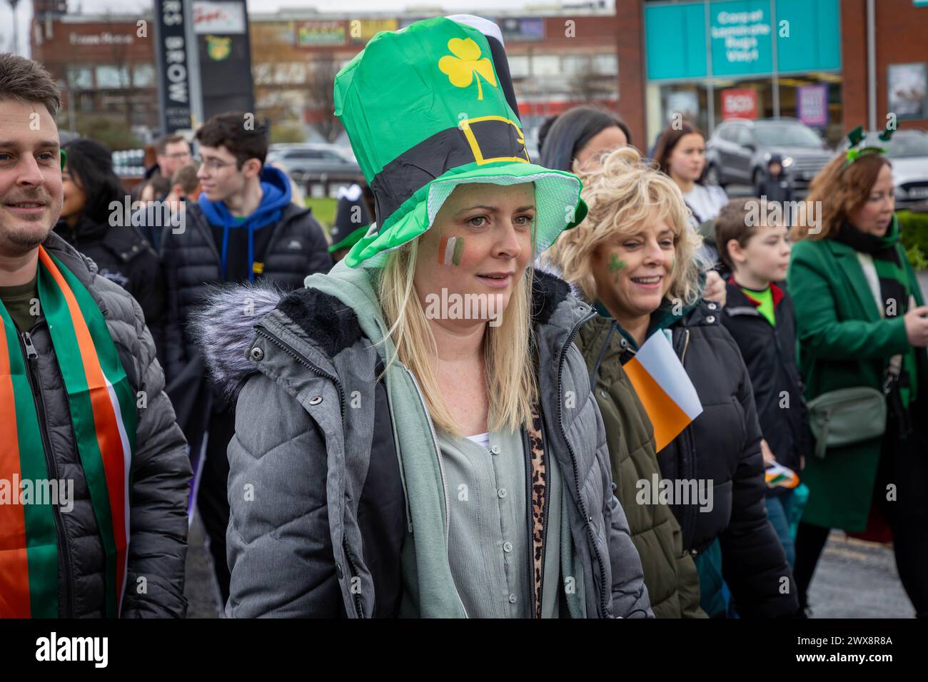 Young female wearing a flimsy St Patrick's Day hat during Warrington's ...
