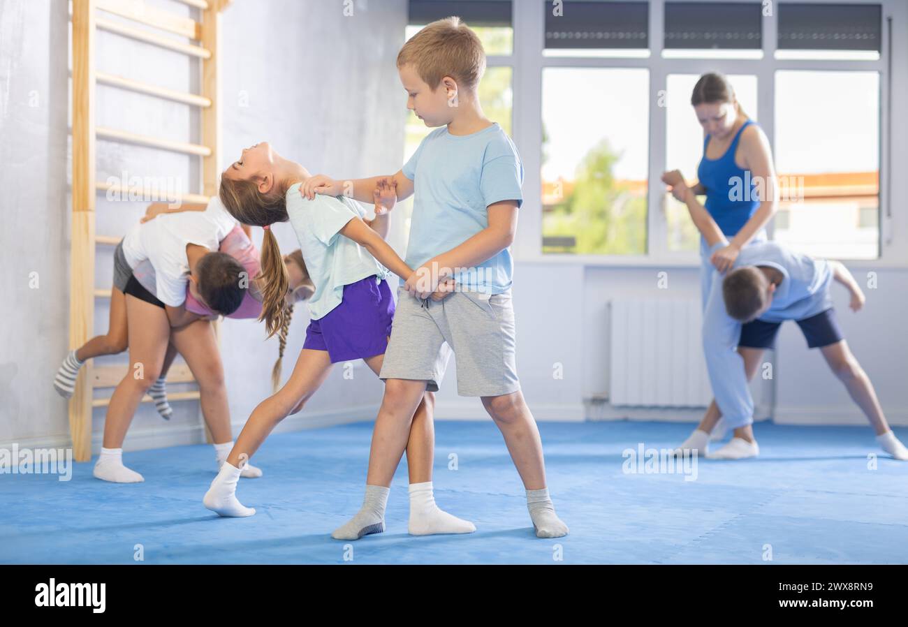 Children are focusing on their hand grip Stock Photo - Alamy