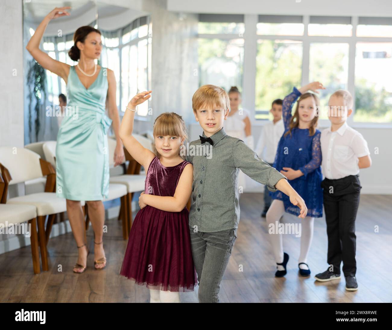 Preteen pupils rehearsing ballroom dance for festive school event Stock ...
