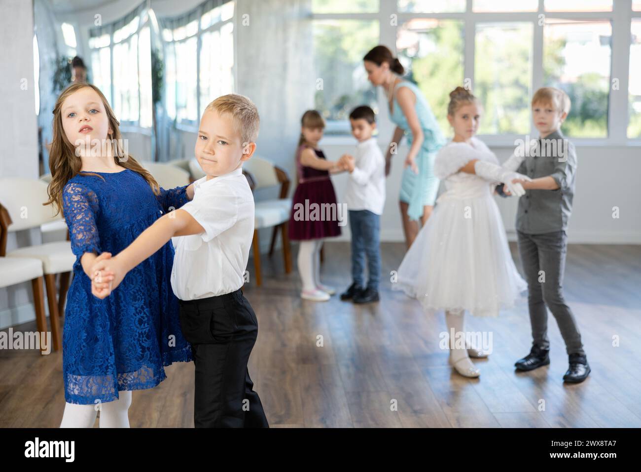 Preteen pupils rehearsing ballroom dance for festive school event Stock ...