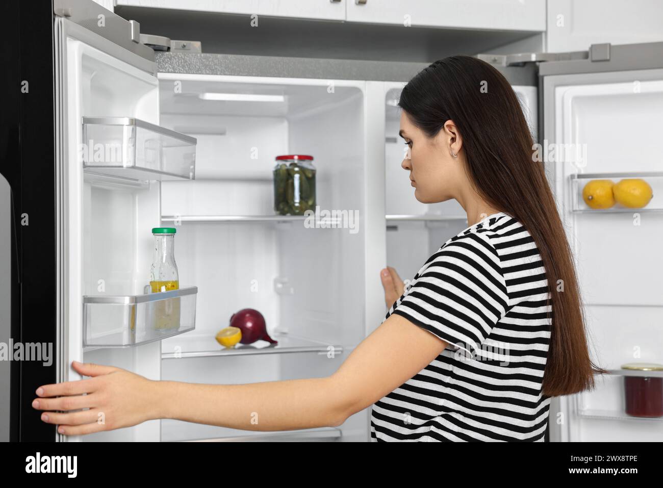 Empty fridge woman hi-res stock photography and images - Alamy