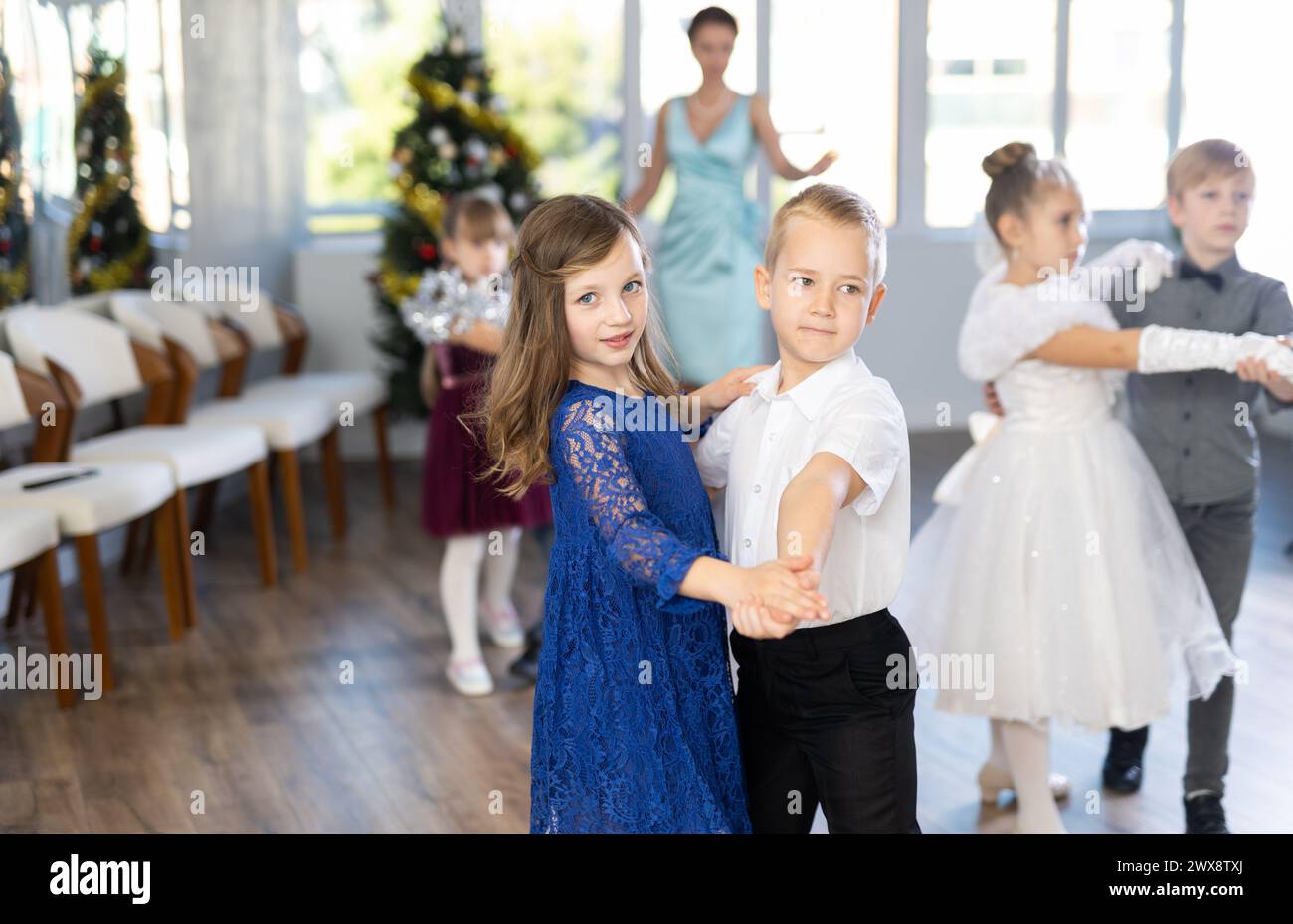Children rehearsing ballroom dance for upcoming Christmas party at ...