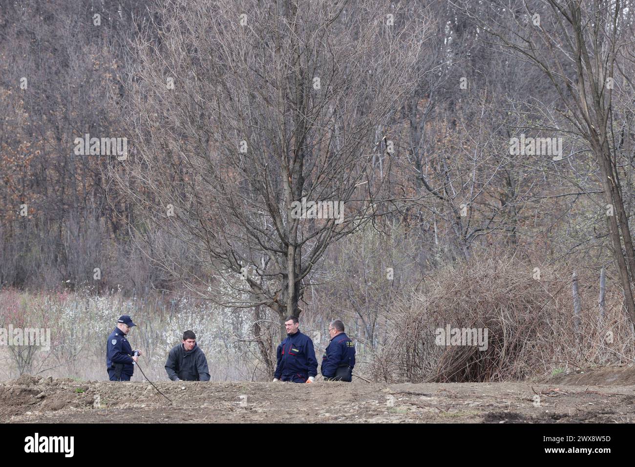 Bor, Serbia. 28th Mar, 2024. Police excavate the area in front of the ...