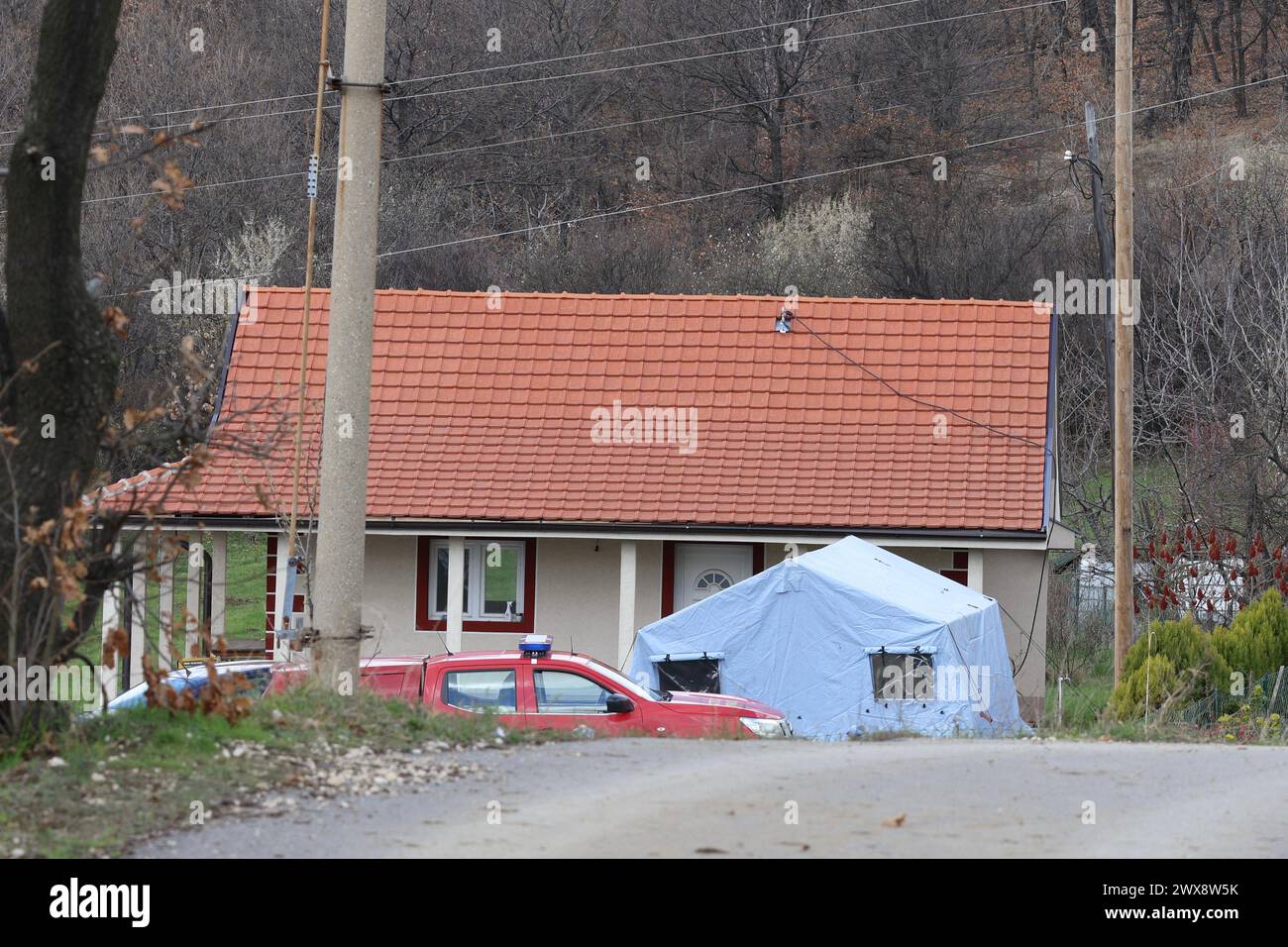 Bor, Serbia. 28th Mar, 2024. Police excavate the area in front of the barn in the suburban ...