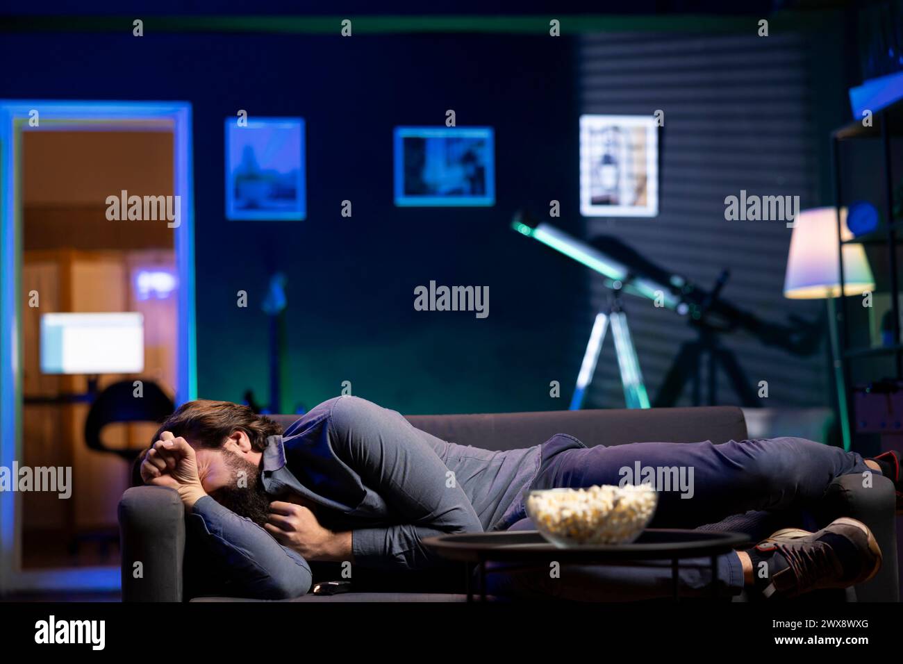 Sad man lounged on couch crying after finishing heartbreaking drama ...