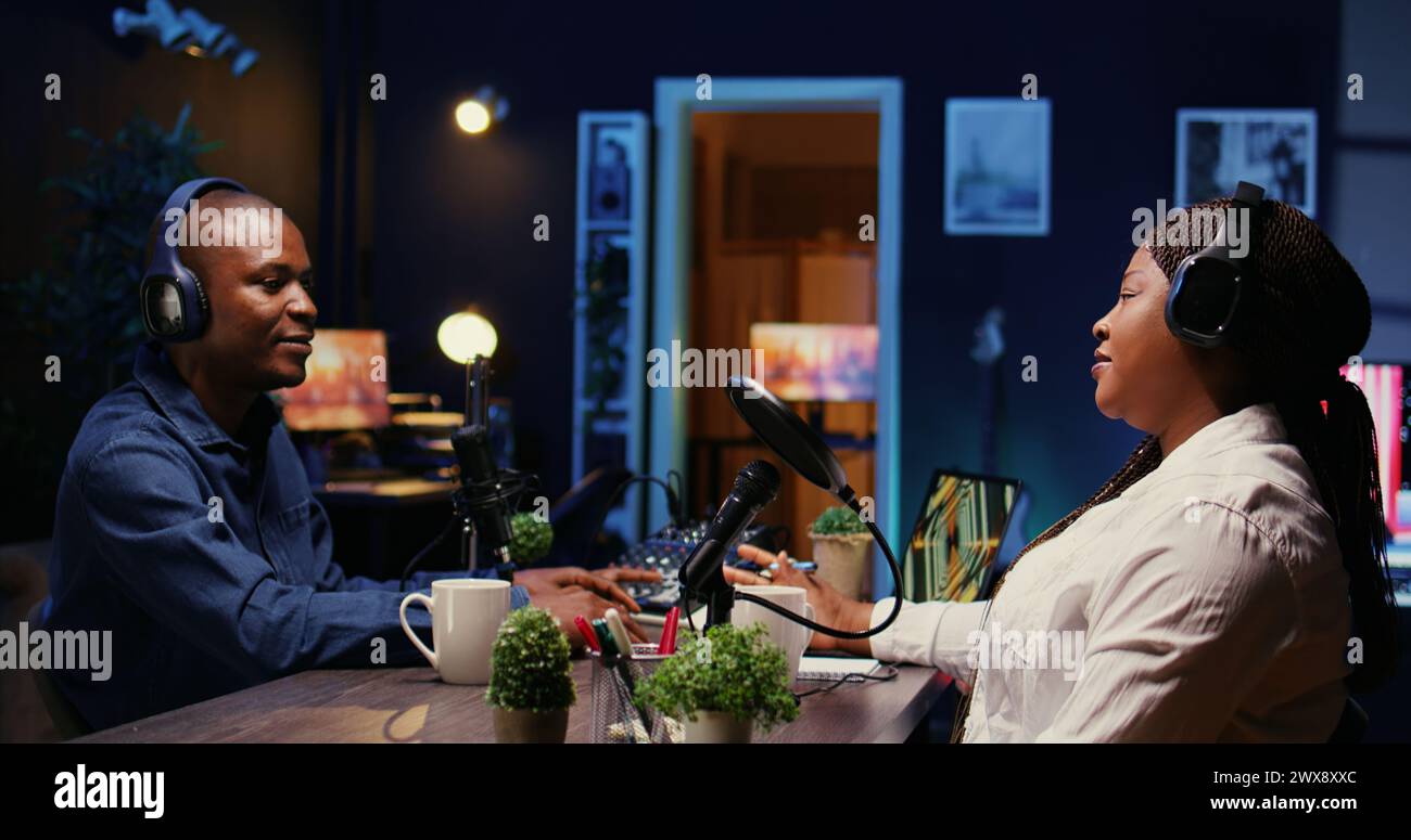 Woman laughing during comedy focused podcast, entertained by funny ...