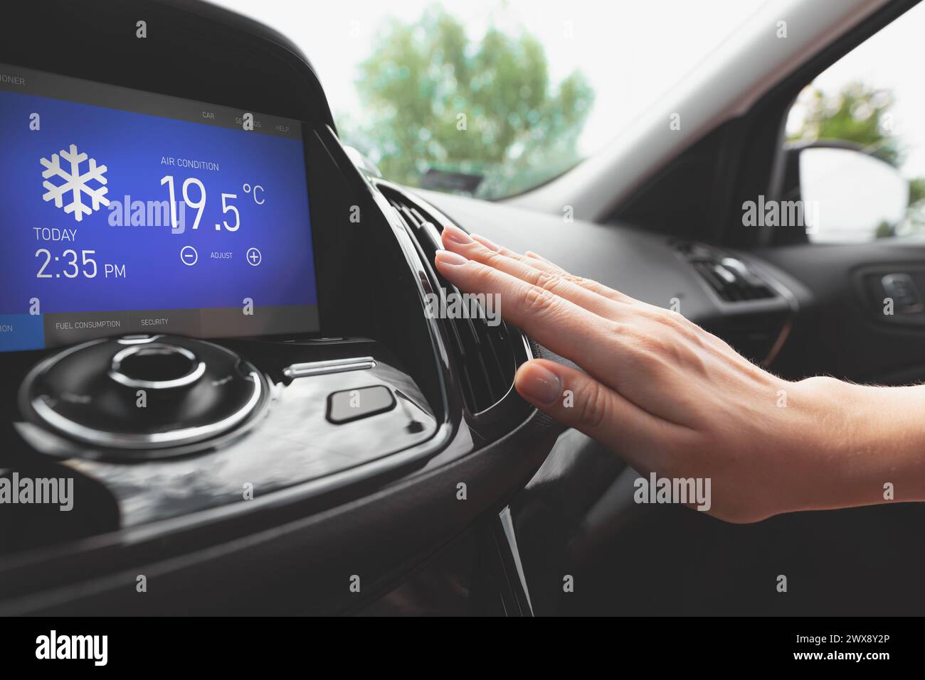 Air conditioning in the car. Cold air.. Driver hand tuning air ...