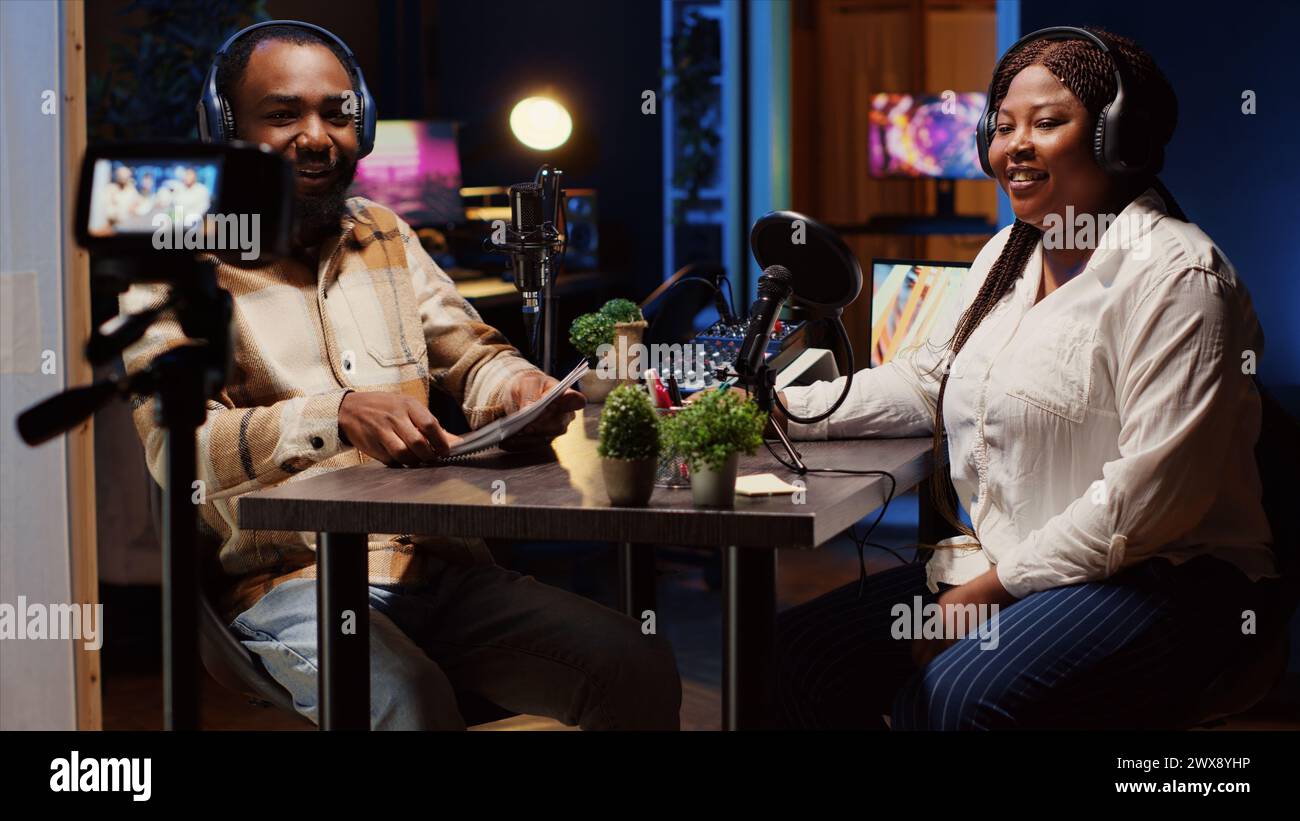 Vlogger show host and guest arriving in neon lights ornate personal ...