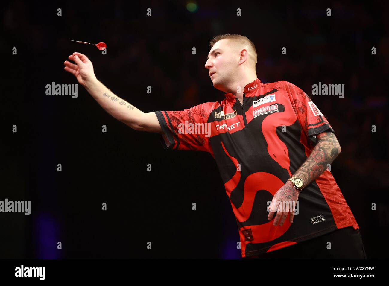 Nathan Aspinall in action against Luke Littler in the final match during night nine of the ...