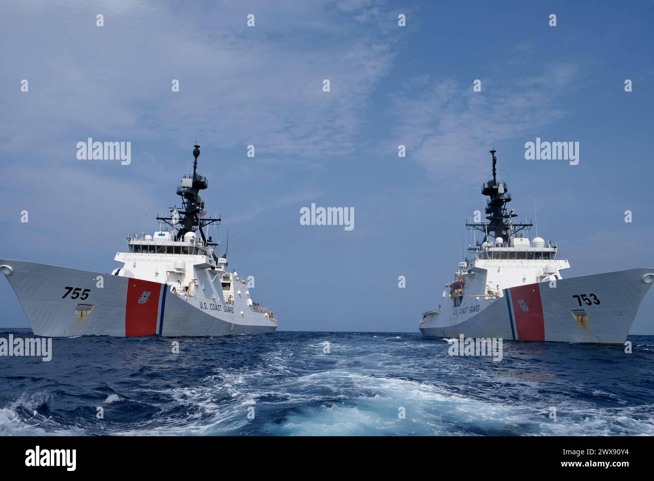 Crews from Coast Guard cutters Hamilton (WMSL 753) and Munro (WMSL 755 ...