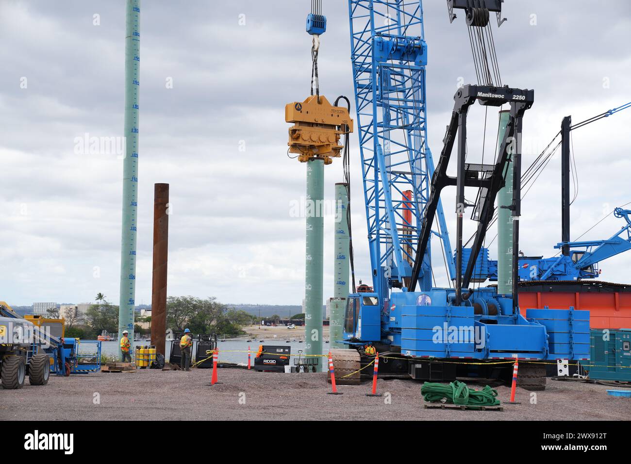 A 36-inch diameter pile is driven in by a vibratory hammer in support ...