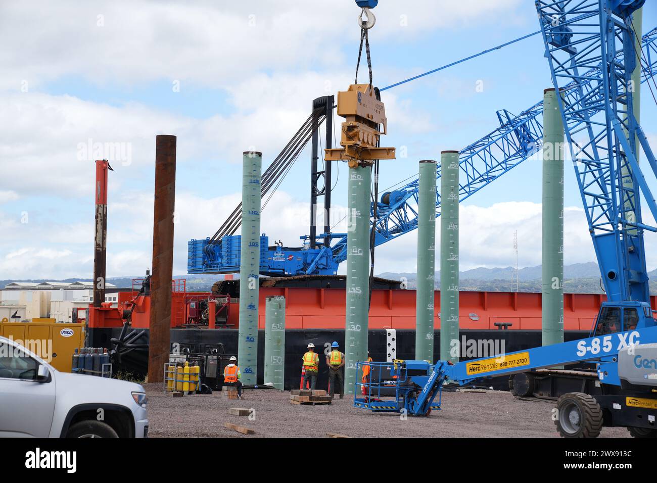 36-inch diameter piles are driven in by a vibratory hammer in support ...