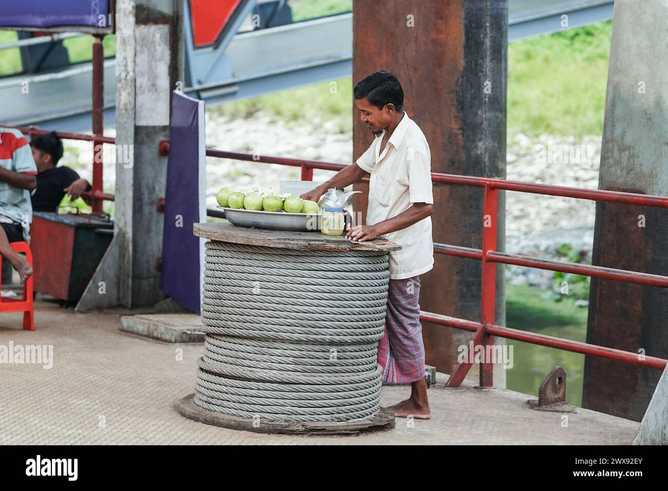 Male vendor selling guava salad at his roadside food stall, Local man ...