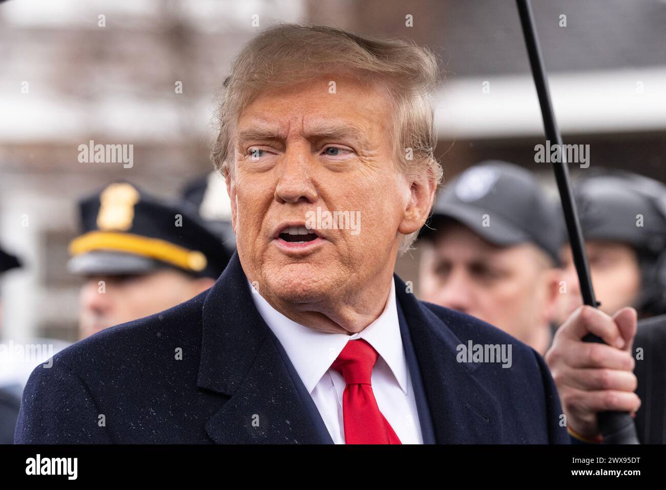 Former President Donald Trump Jr. speaks to the press after attending ...