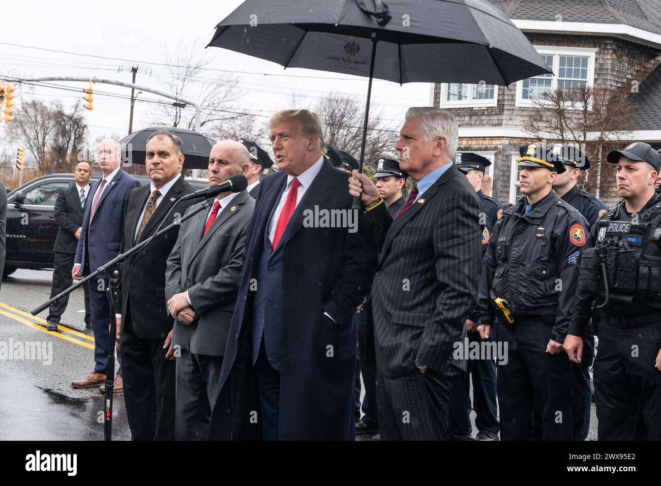 Former President Donald Trump Jr. speaks to the press after attending ...